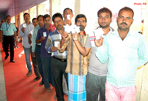 Voters standing in a queue to cast their votes